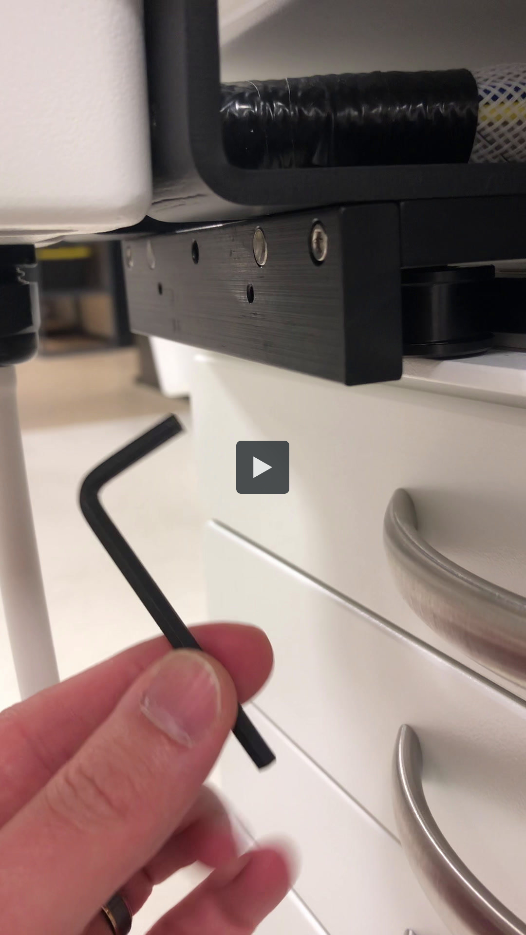 Adjusting the tension screw on swivel arm bracket | Video Library